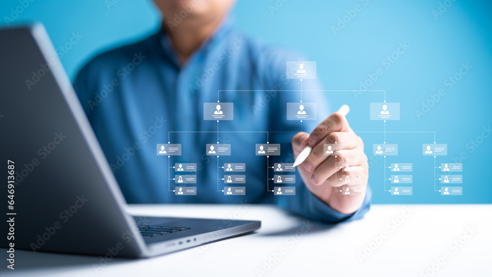 Businessman draw on virtual screen to arrange organization chart, mind ...
