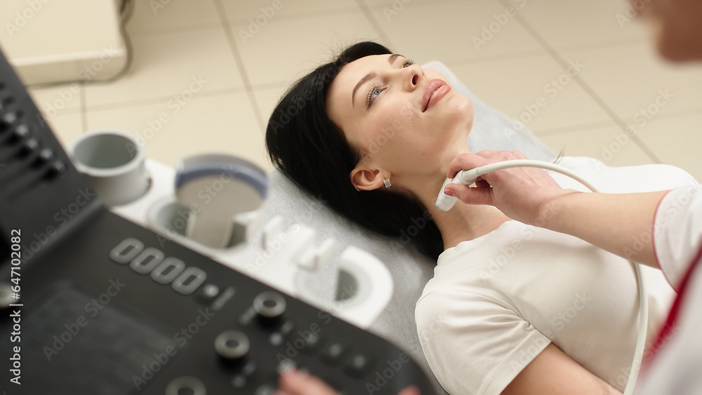 Ultrasound diagnosis of the thyroid gland of a young woman in the ...