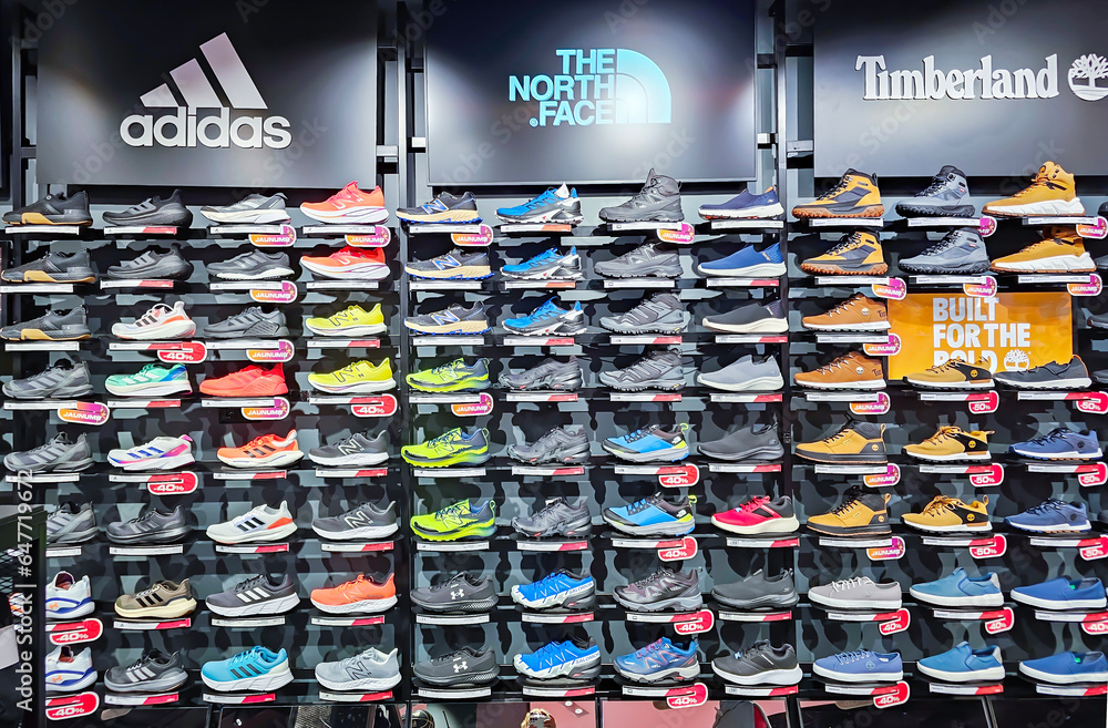 Latvia, Riga, 23, August, 2023: Shelves of sneakers from famous sports ...