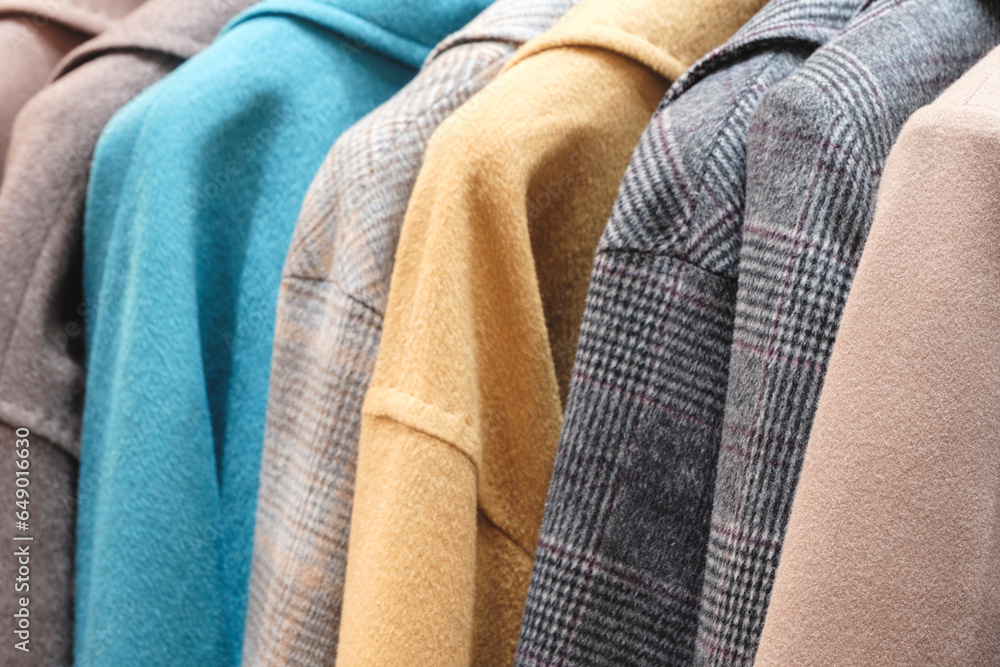 Fashion clothes on clothing rack Closeup of rainbow color choice female ...