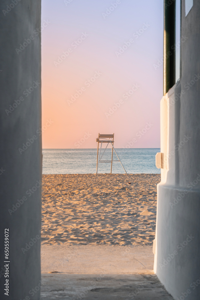 Sunrise on the beach with lifeguard chair room for text - Coastal ...