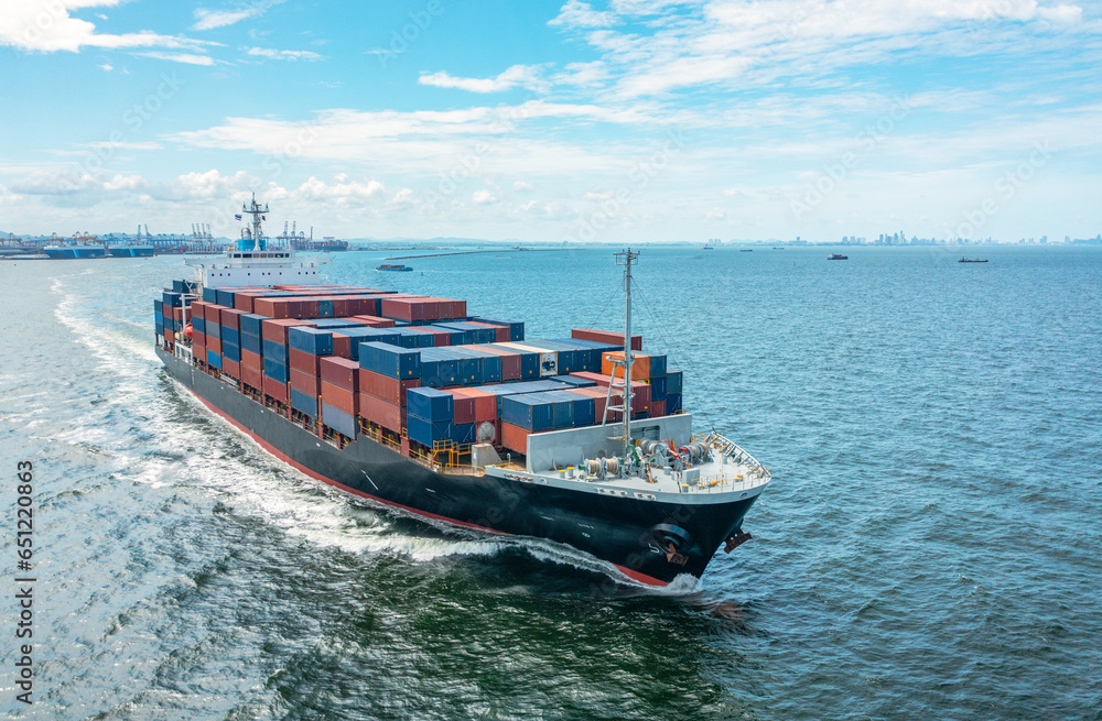 Top view Container ship full capacity approaching the port International Container ship loading ...