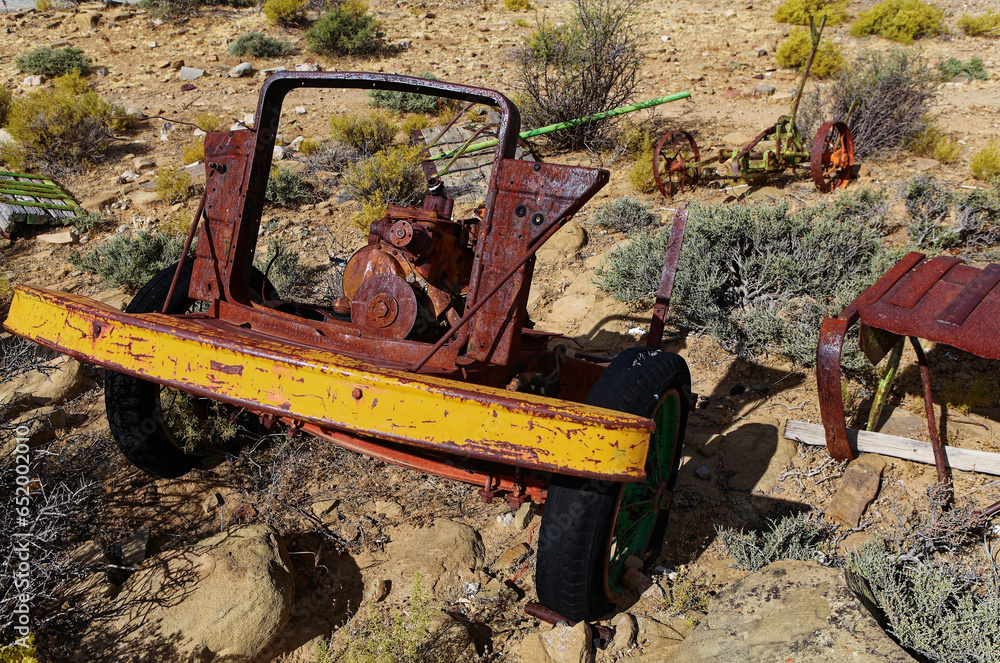 Old metal parts of vehicles and farm equipment in the veld on a farm ...