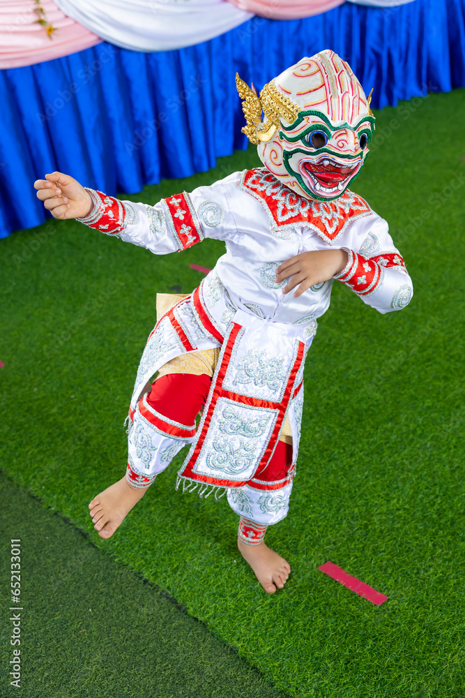 Happy and smile Asian boy wearing Hanuman Khon. Hanuman is Thailand ...