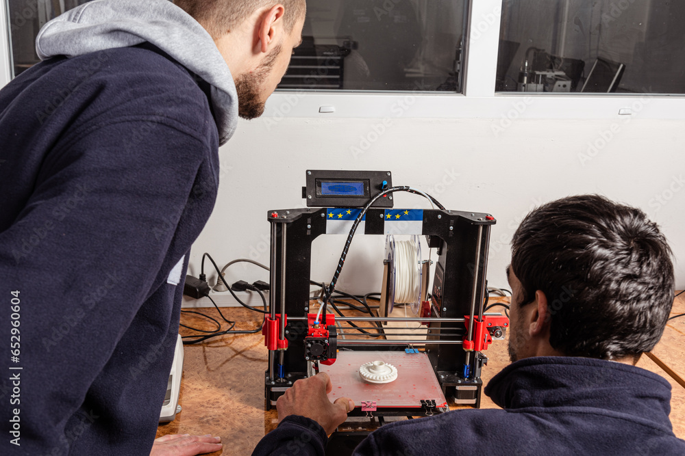 3D scanning and printing training class. Teacher shows how to work on ...