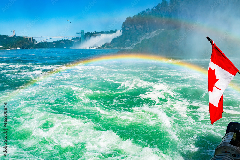 Huge rainbow and Canadian flag, view of Bridal Veil Falls, Niagara ...