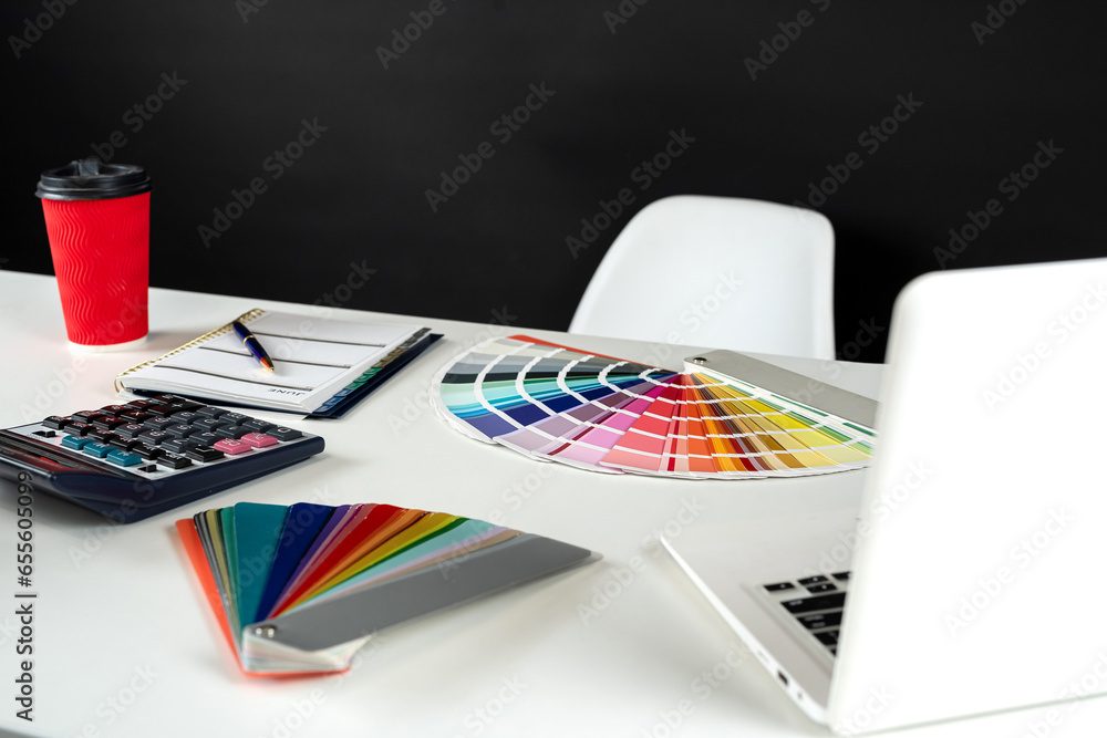 Designer workplace laptop color sampler catalog empty notepad pen and ...