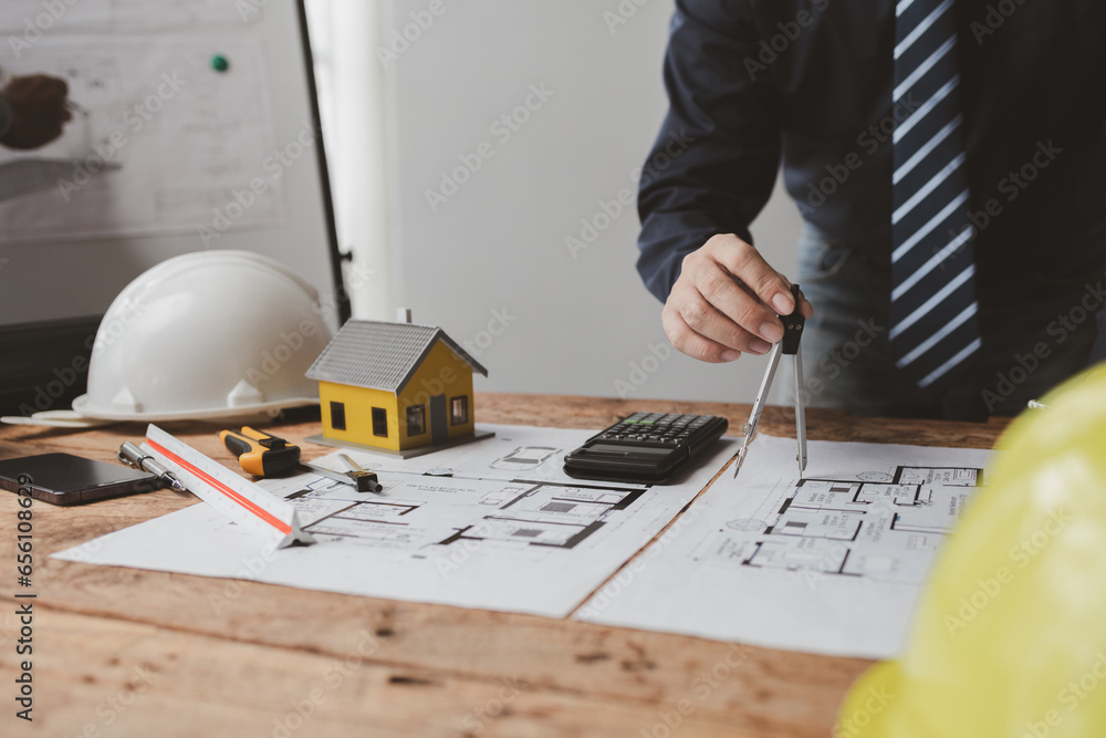 Architects design house plans for clients, drawing plans according to ...