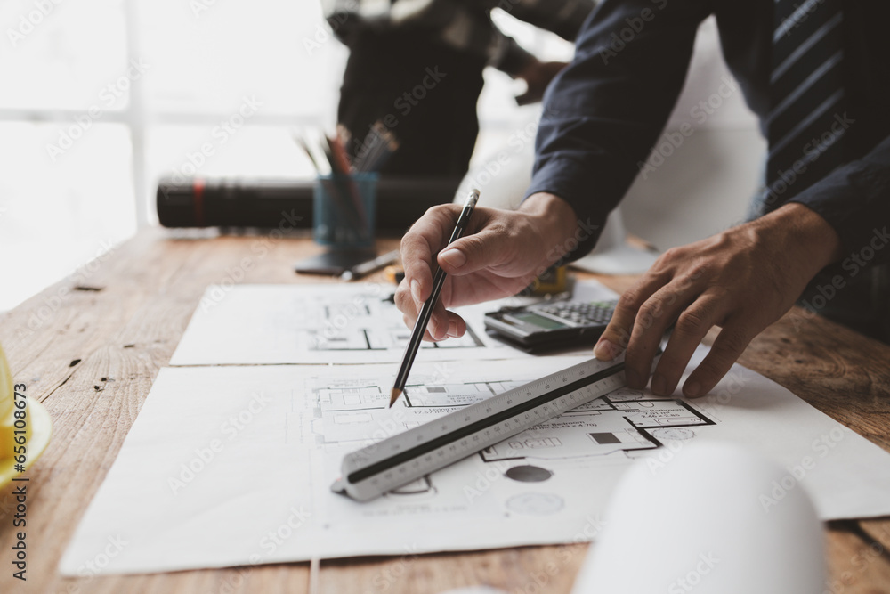 Architects design house plans for clients, drawing plans according to ...