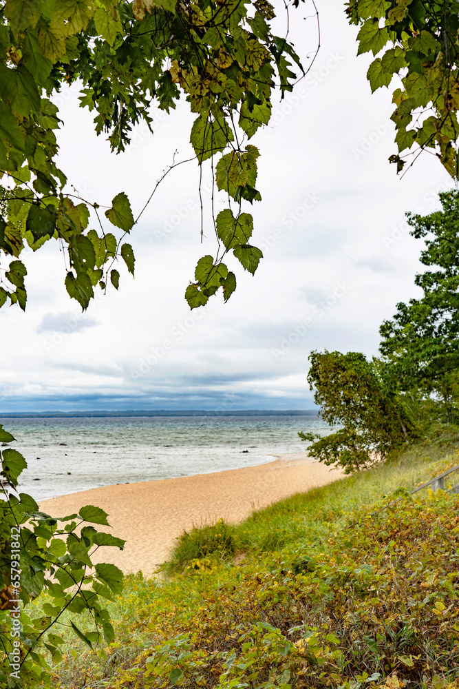 Traverse Bay Lake Michigan shoreline with sandy beach and water is ...