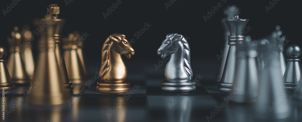 Gold and silver chess pieces in chess board game for business ... Gold and silver chess pieces in chess board game for business ...