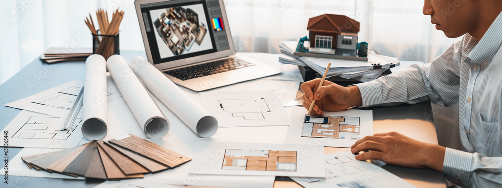 Interior architect designer at table designing hand drawing house ...