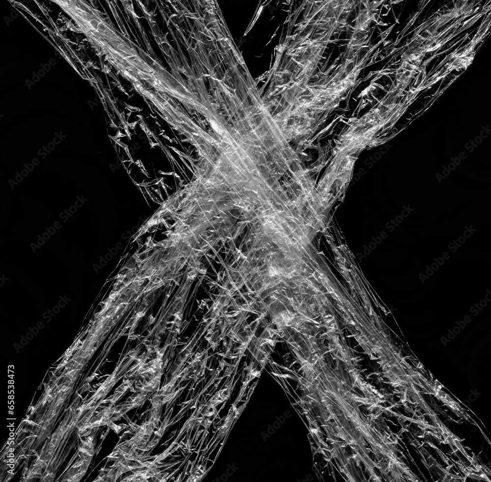 Wrinkled plastic wrap texture on a black background wallpaper. Royalty ...