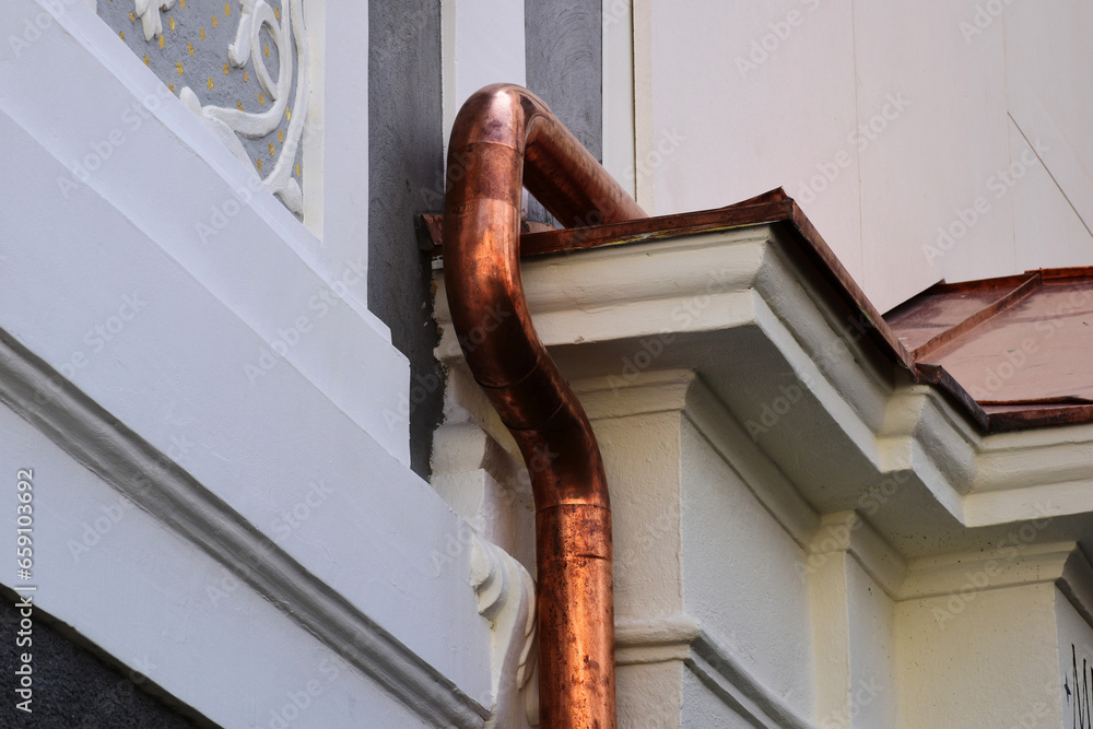 shiny new copper rain water leader, downspout or down pipe detail ...