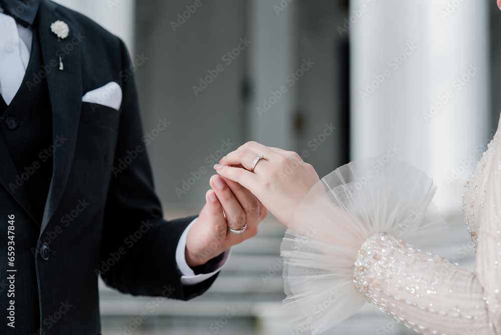 Muslim couple holding hands together with wedding rings, Muslim wedding ...