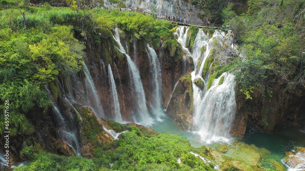 Plitvice Lakes National Park with many waterfalls. Clean water flows ...