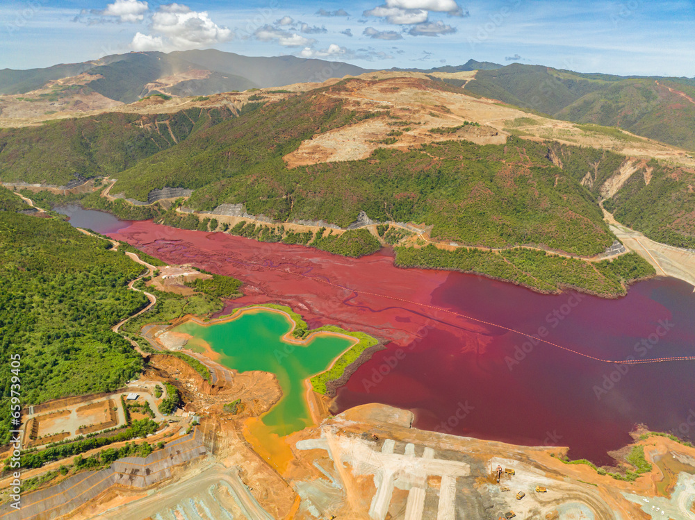 A lake with polluted water in a nickel mine. Mining in an open pit ...