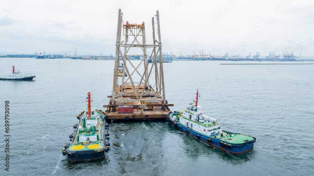 Tugboat pull Big Construction on ship. Tender Drilling Oil Rig on Barge ...