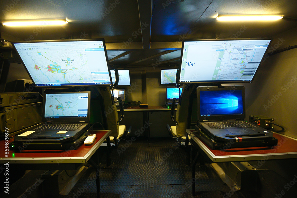 Mobile command centre. Operator workplace computers, monitors and seats ...
