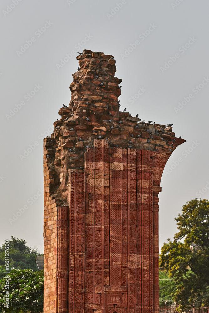 Stone column with decorative bas relief of Qutb complex in South Delhi ...