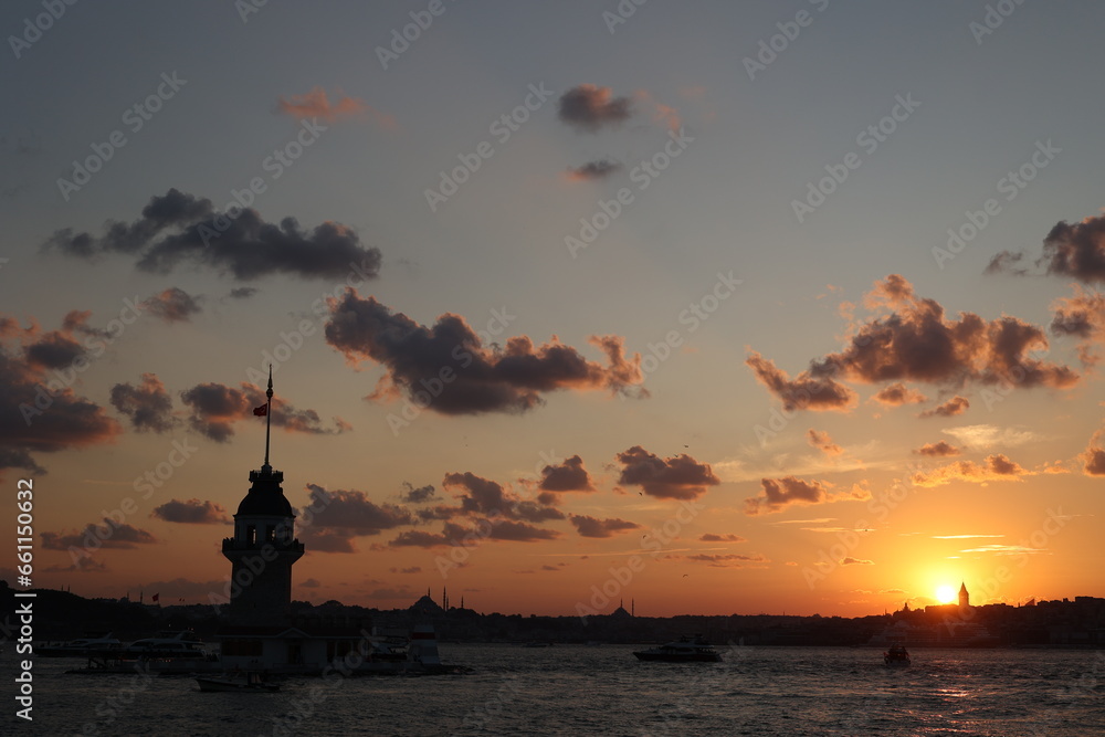 Fiery sunset over the Bosphorus with the famous Maiden's Tower (Kiz ...