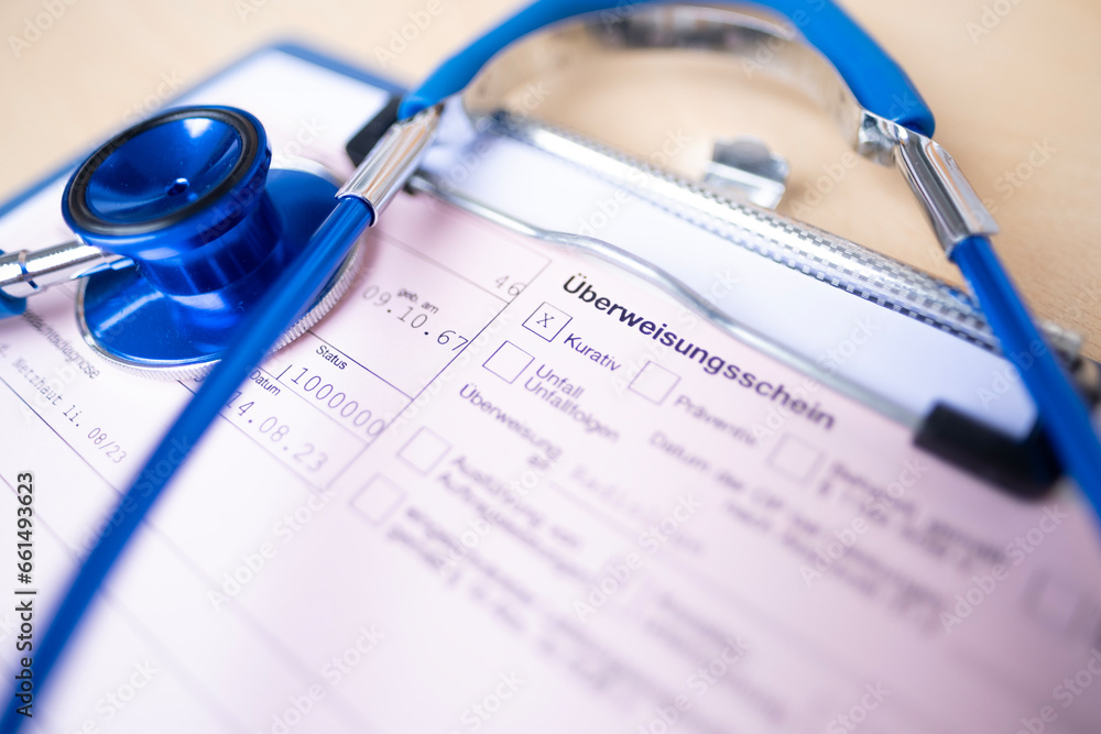 list of patient's medical history, blue stethoscope, document in German ...