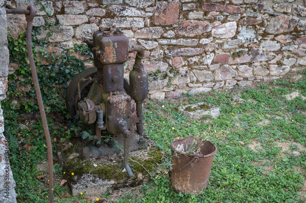 Detail of an old annual starter motor with lever and a pulley for ...