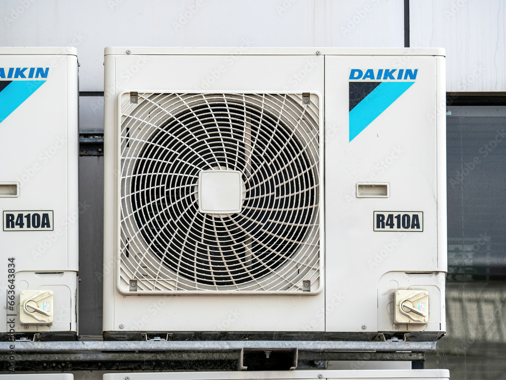 Daikin air conditioner outdoor unit with R410A refrigerant sign. Stock ...