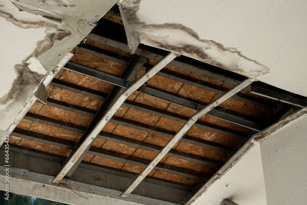 Ceiling panels had damaged a large hole in the roof from a rainwater ...