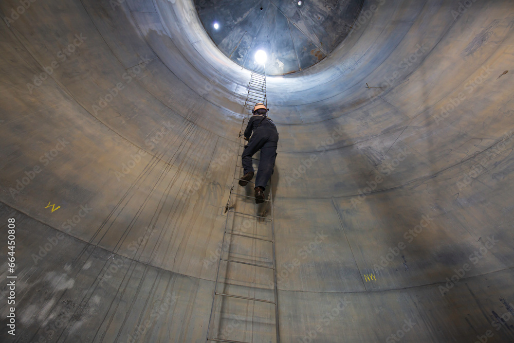 Male inside climb the stairway storage visual inspection tank Stock ...
