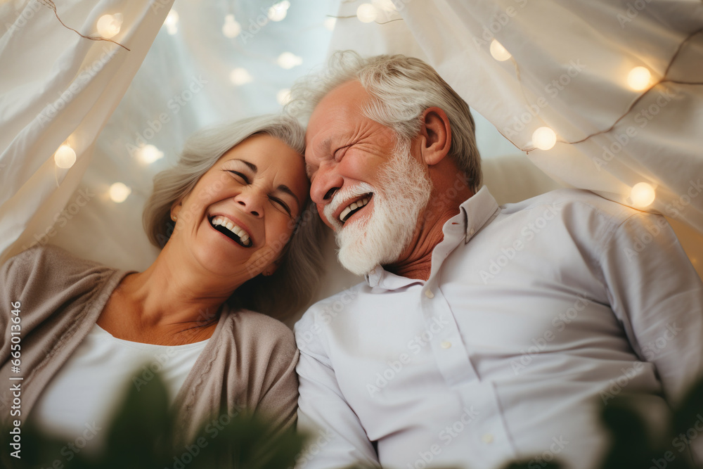 Stock-Foto „senior couple laughing together in bed, fun and joy, old ...
