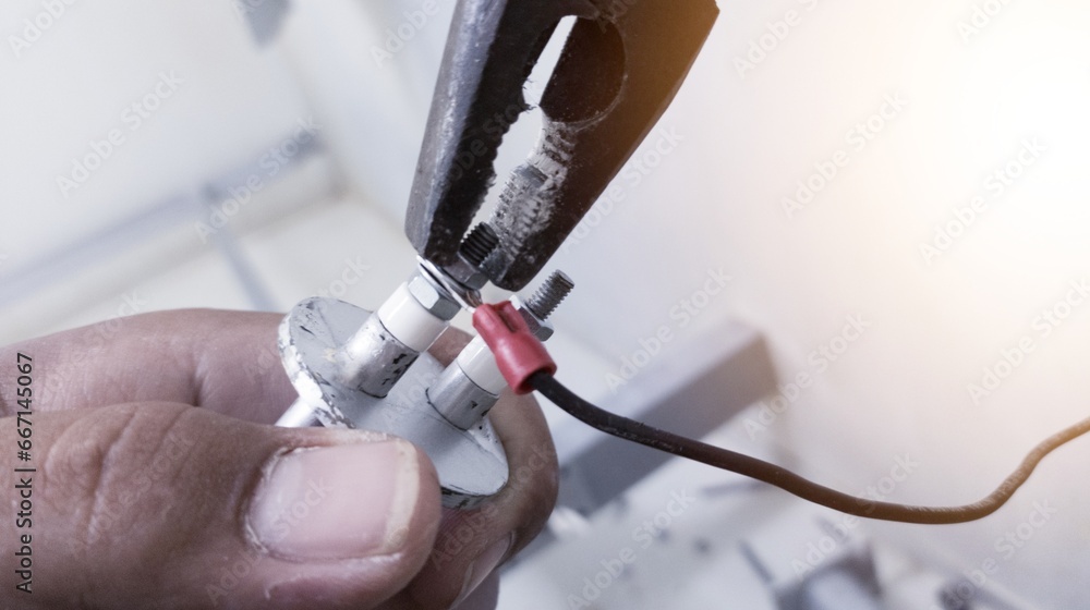 The process of tightening the heater element terminals using ...