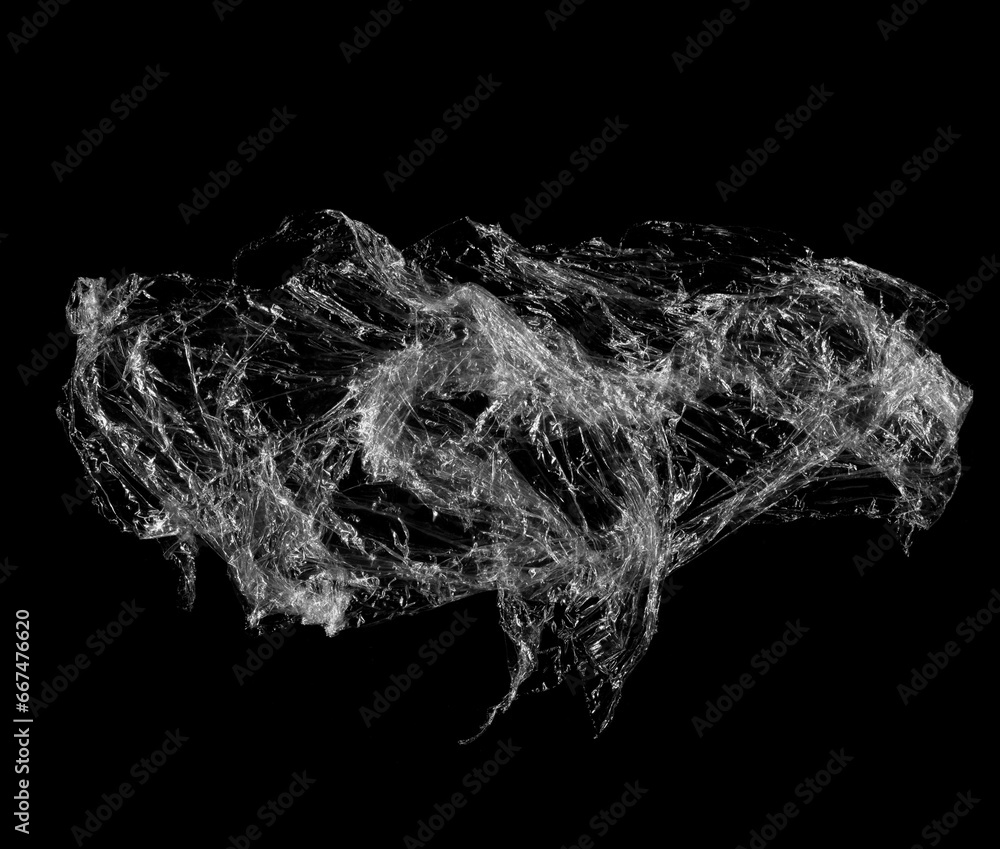 Wrinkled plastic wrap texture on a black background wallpaper. Royalty ...