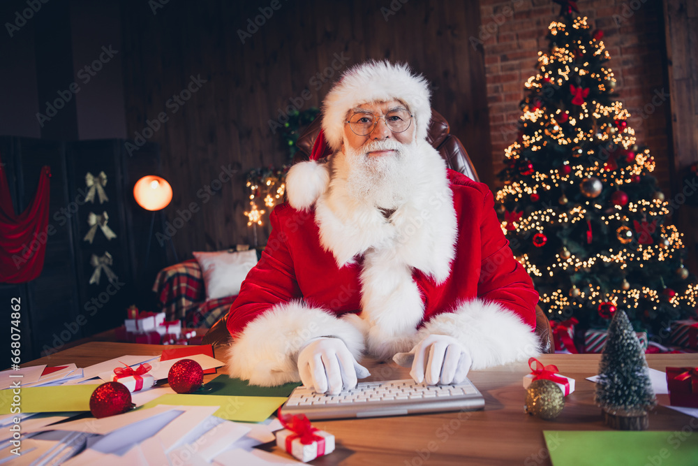 Photo of positive good mood santa claus dressed red costume typing ...