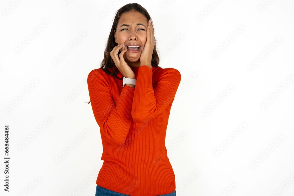 Doleful desperate crying Beautiful girl wearing red sweater , looks ...