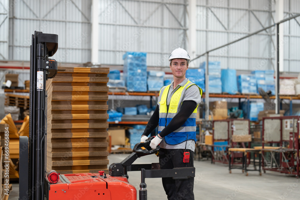 Man worker driver using forklift electric or electric pallet stacker ...