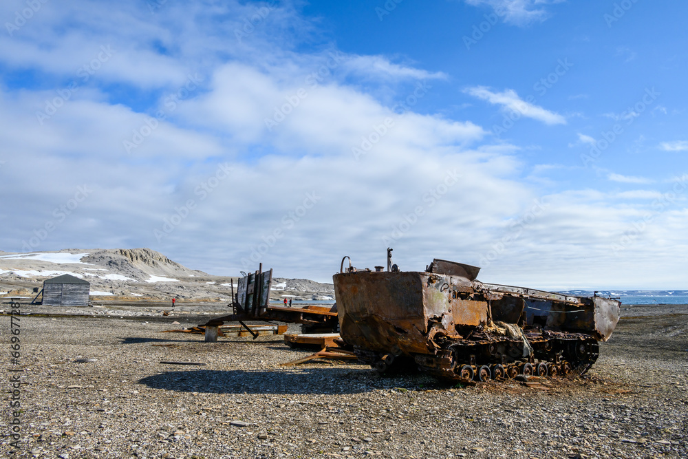 Rusted old snow machine and other equipment at research station at ...