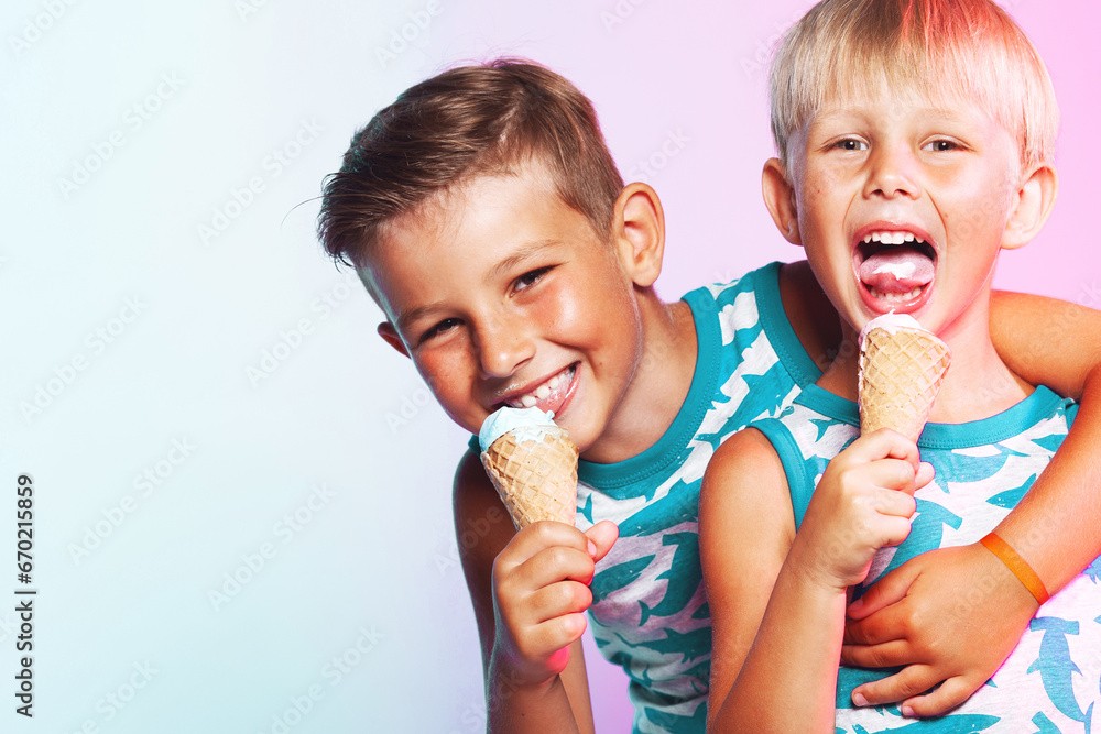 Tasty treat concept. Happy two young handsome brothers wearing ...