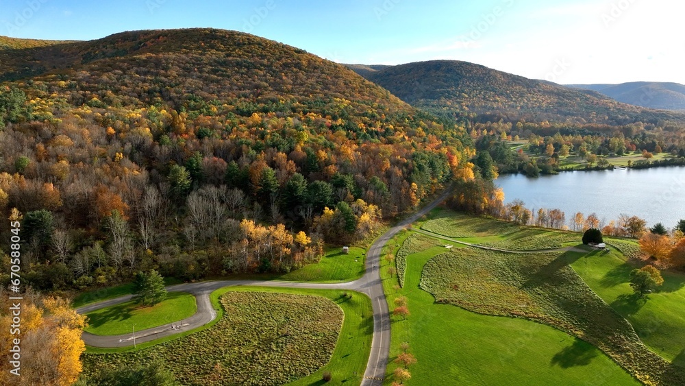 Mountain, trees and fields in sunny landscape with campground and ...