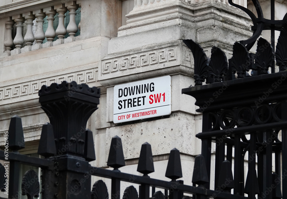 Downing Street sign on the wall of government building in Westminster ...