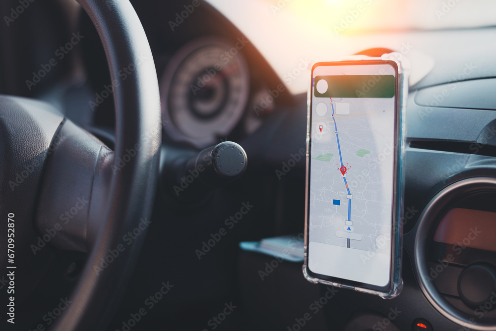 The phone's map appears on the dashboard and street in the background ...