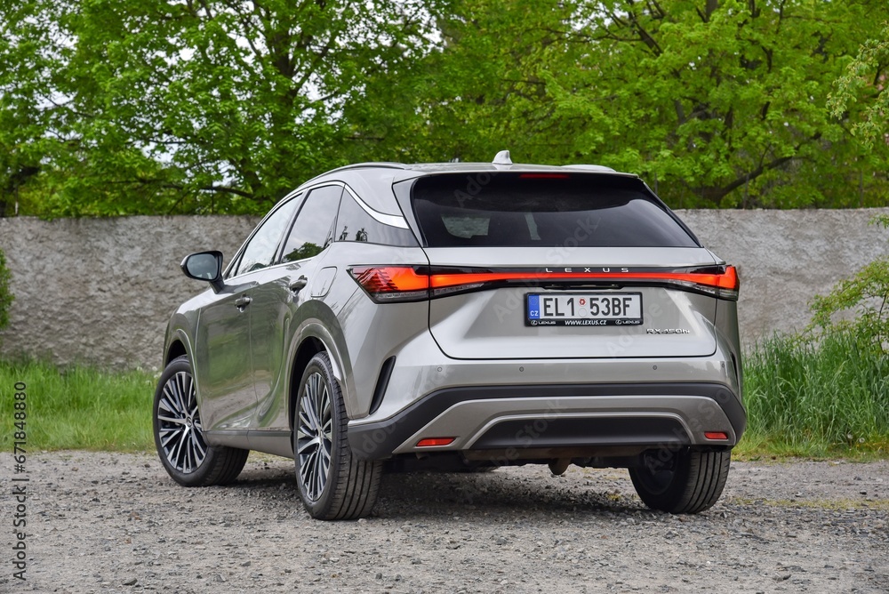 Lexus RX 450h+. A luxury car with a plug-in hybrid drive. General rear ...