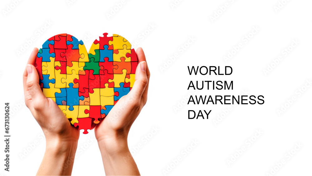 World autism awareness day concept. Adult hands holding puzzle heart on ...
