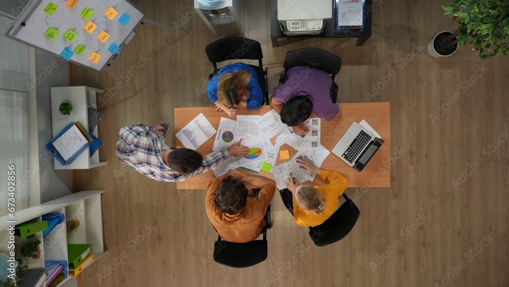 Top view of office boardroom with young men and women workers. Boss ...