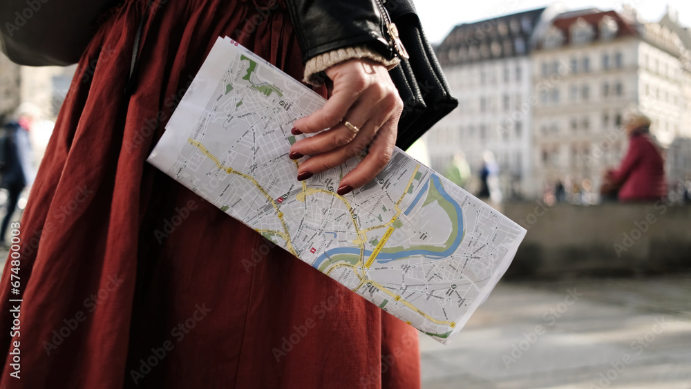 Female Tourist Strolls Through Central Streets In Dresden, Carrying ...