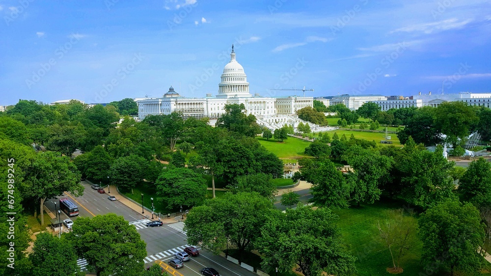Green park with the United States Capitol building in the background ...