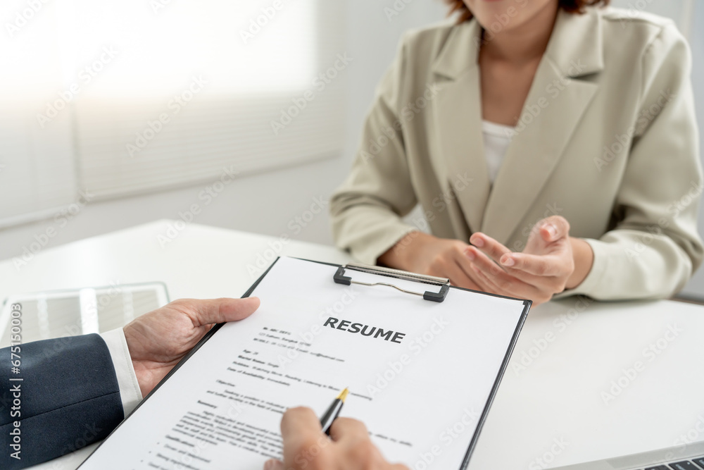 Executives accept job application documents and read job applicants ...