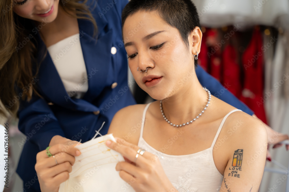Young female designer learning to make dress at designer school ...
