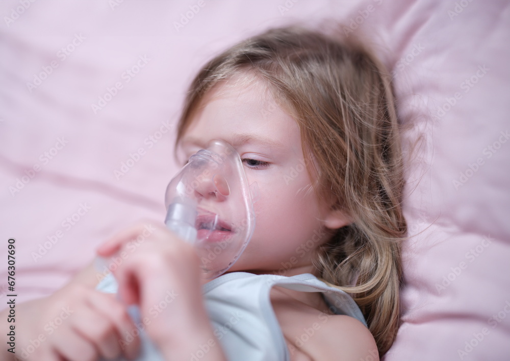 Little girl making inhalation of hormonal drug using nebulizer ...