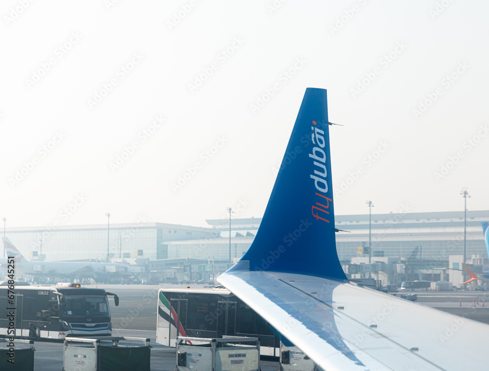 Dubai, United Arab Emirates - October 11, 2023: Plane wing with Fly ...